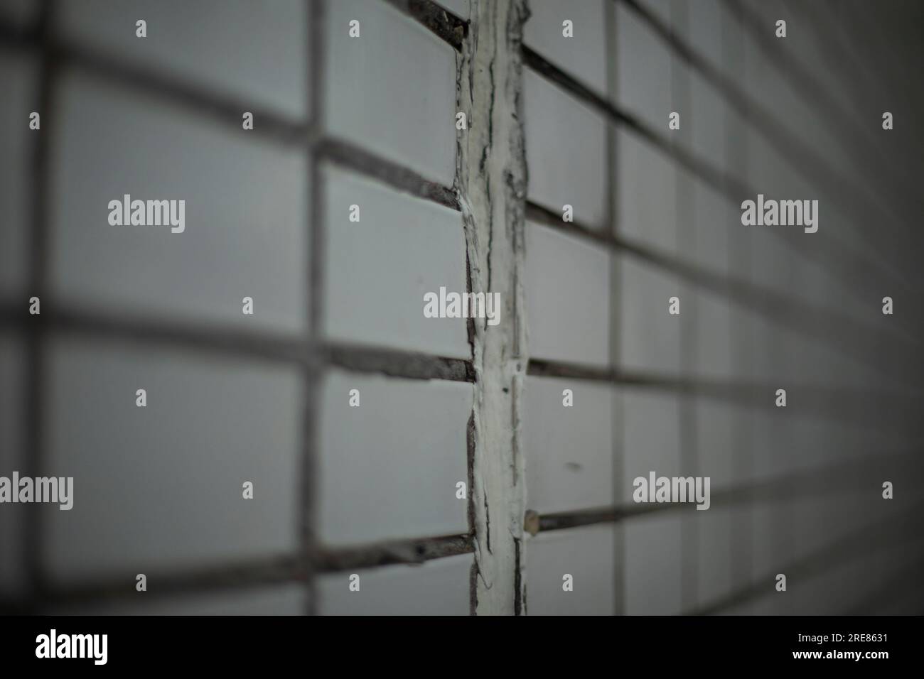 Wall of tiles. Tiles in cladding of building. Wall details. Plain ...