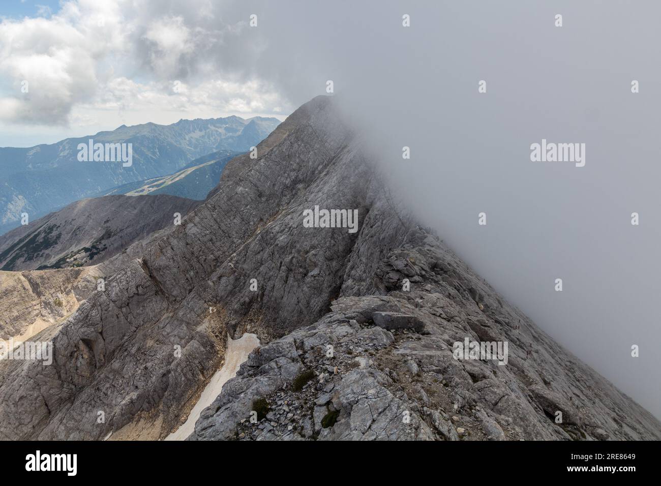 Koncheto ridge in Pirin mountains with fog at a side, Bulgaria Stock ...