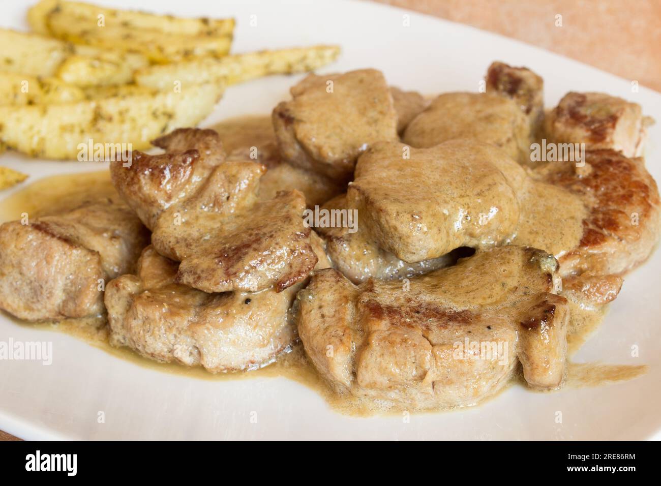 A close up of medallions bathed in a sauce of Cabrales with meat juice ...