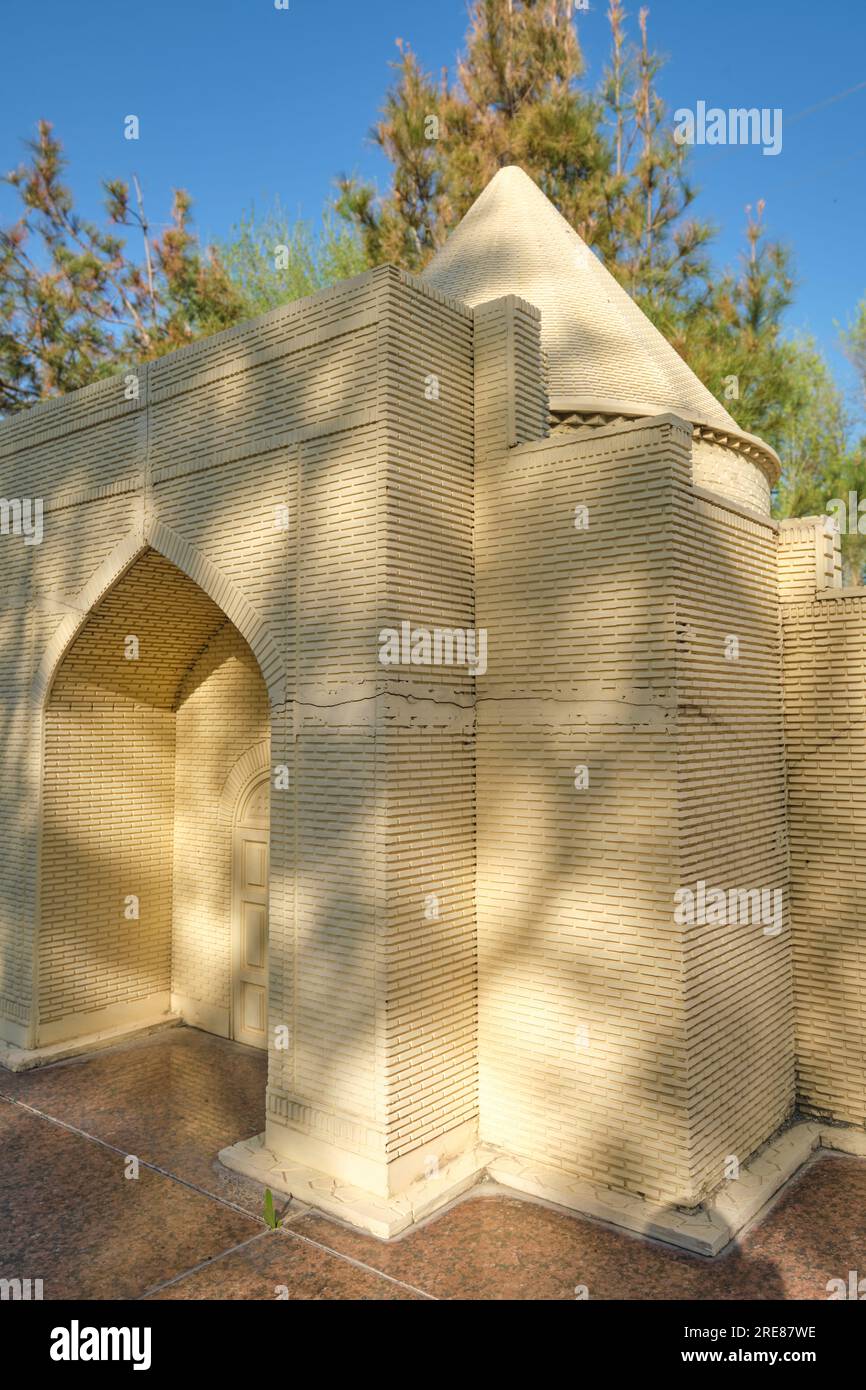 A view of a unique masoleum with a central, coned shaped dome. A ...