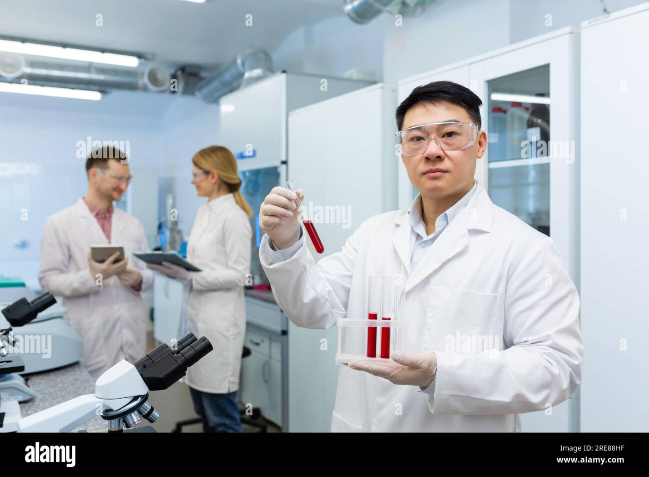 Lab technician doctor analyzing virus hi-res stock photography and ...