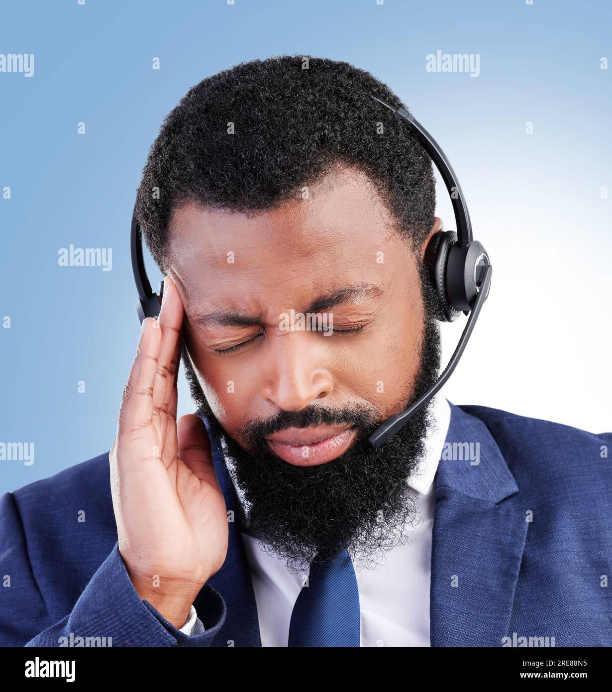 Customer service, studio face and black man headache, stress or sad ...