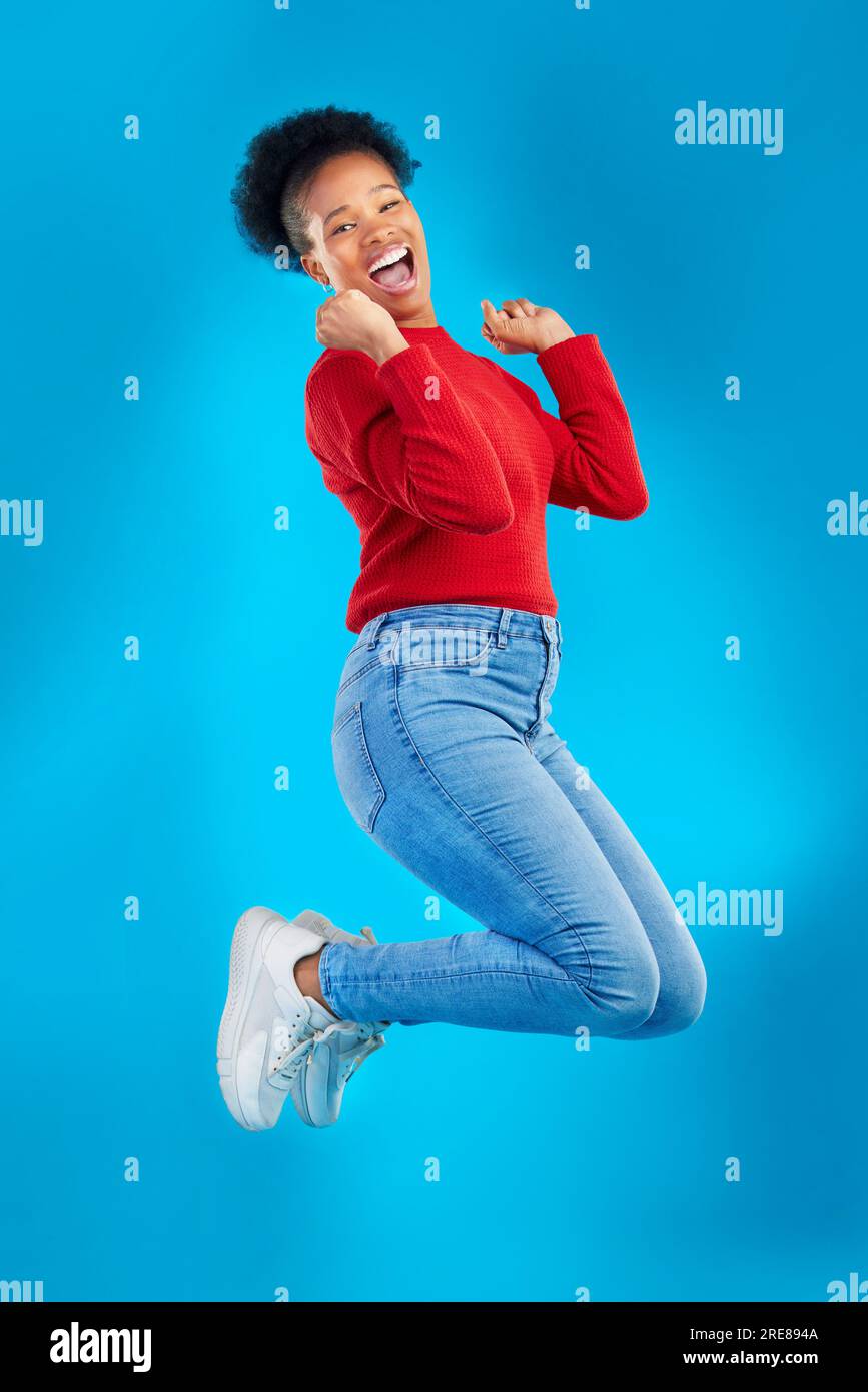 Excited, jump and woman portrait with winner, deal and smile in a ...