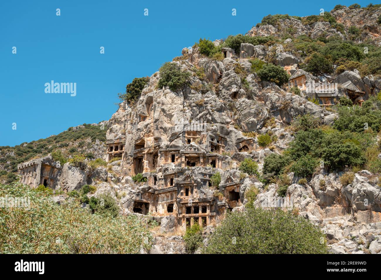 The ruins of the amphitheater and ancient rock tombs in the ancient ...