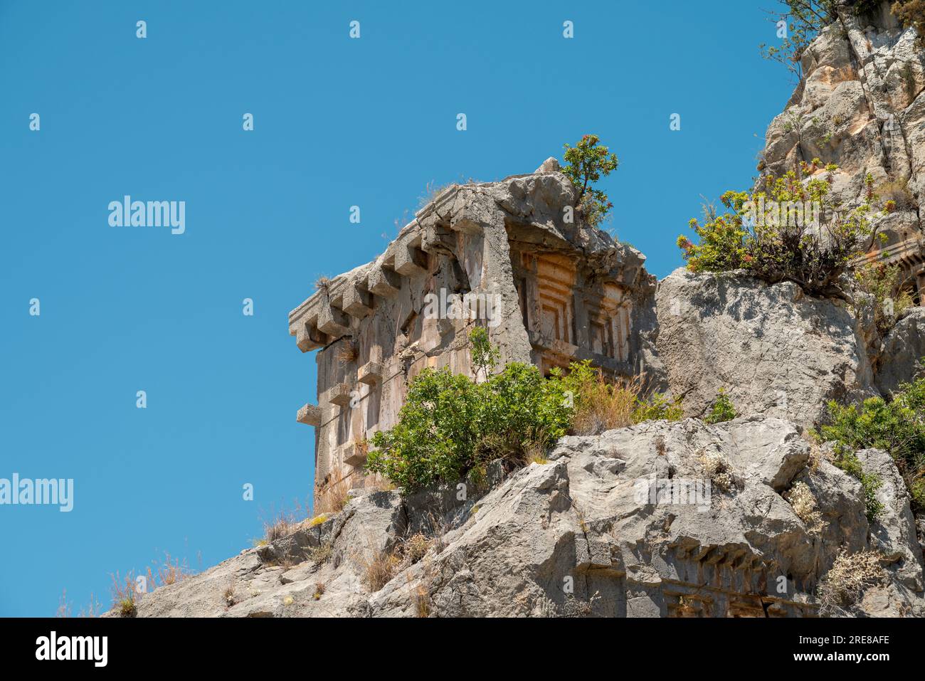The ruins of the amphitheater and ancient rock tombs in the ancient ...