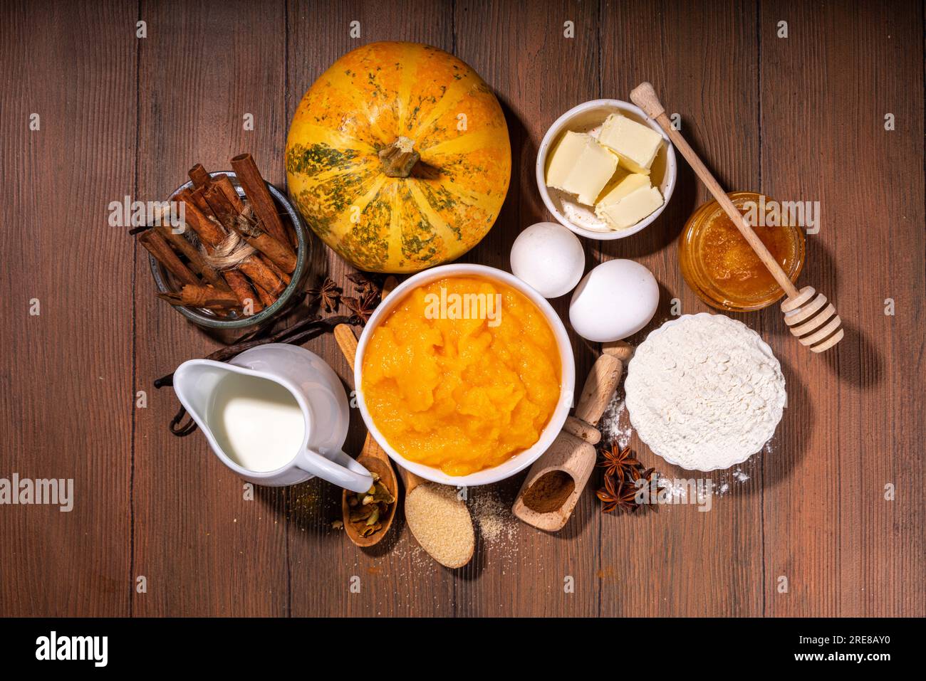 Set of pumpkin pie ingredients - pumpkin puree, spices, cinnamon, dough ...