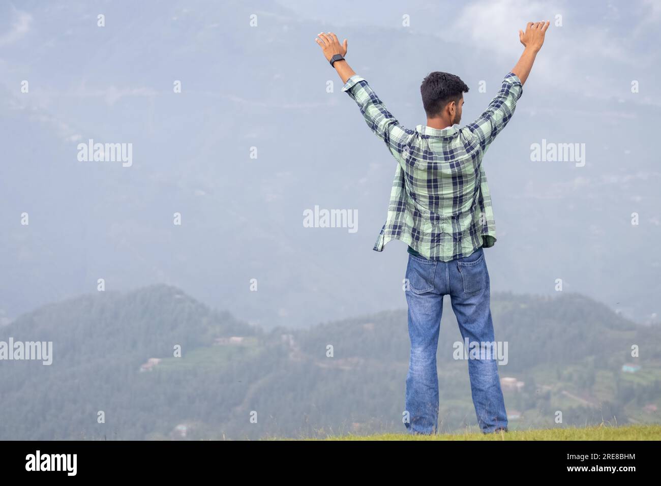 boy open arms relaxing at top peak of mountain feeling fresh pure ...