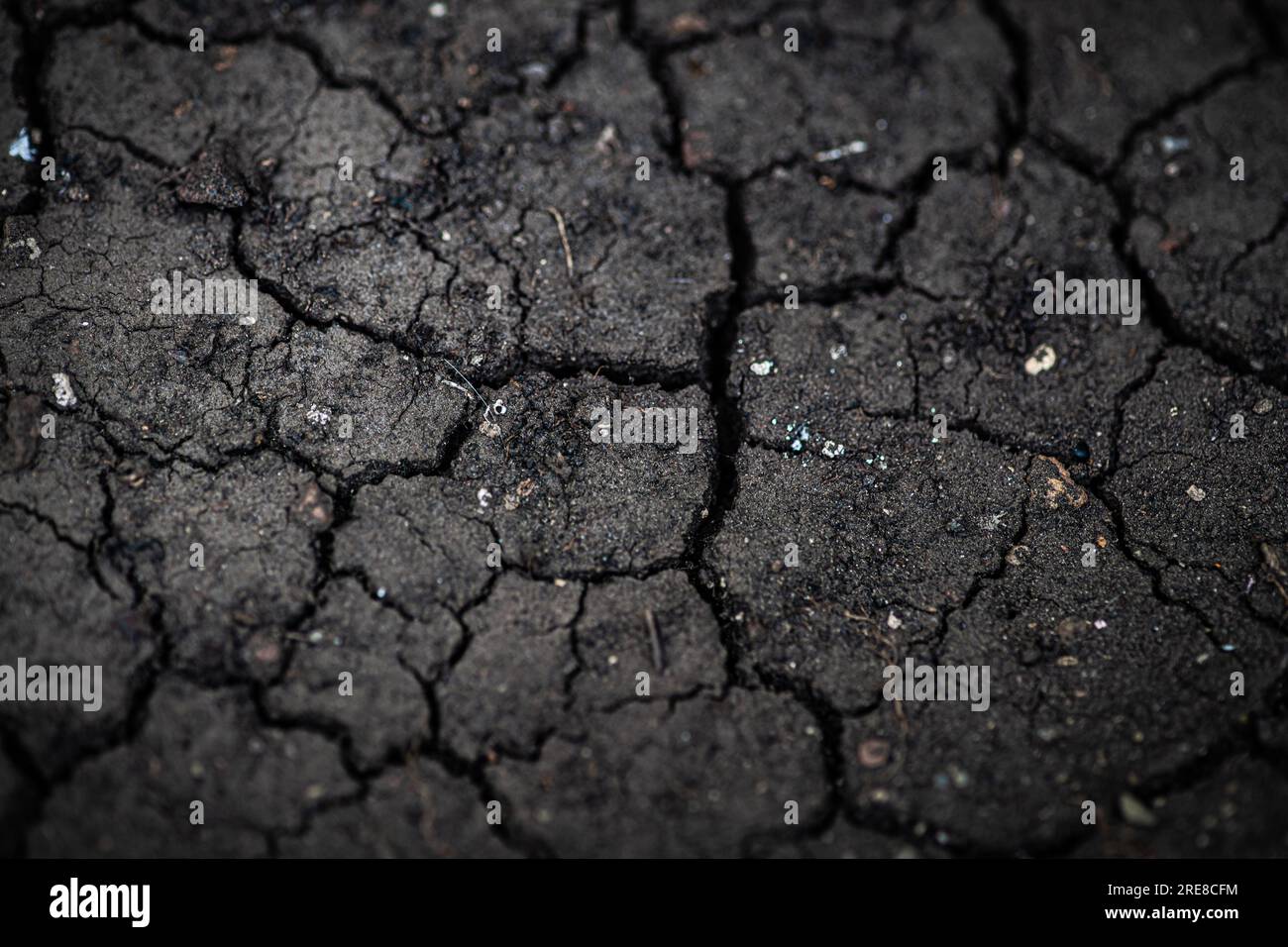 Black soil with cranck as a natural background Stock Photo - Alamy
