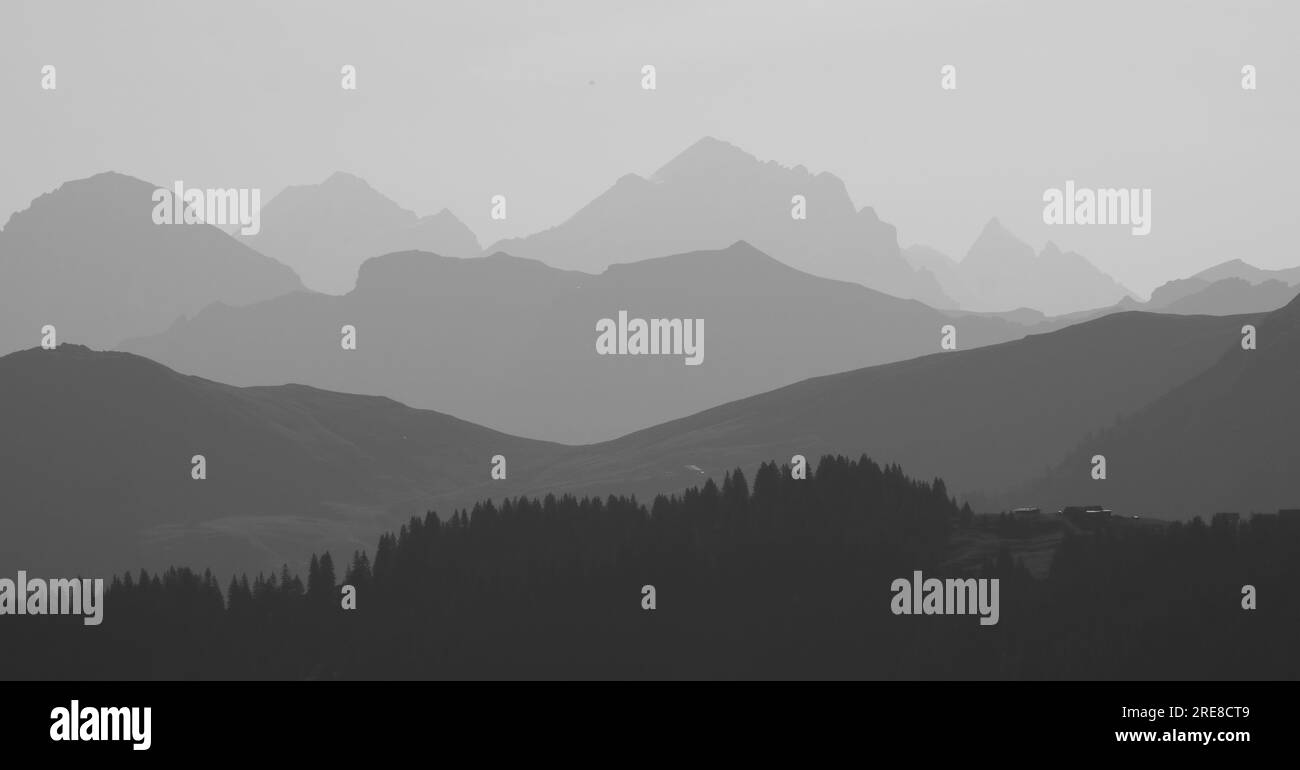 Monochrome image of mountain ranges in the morning light seen from ...