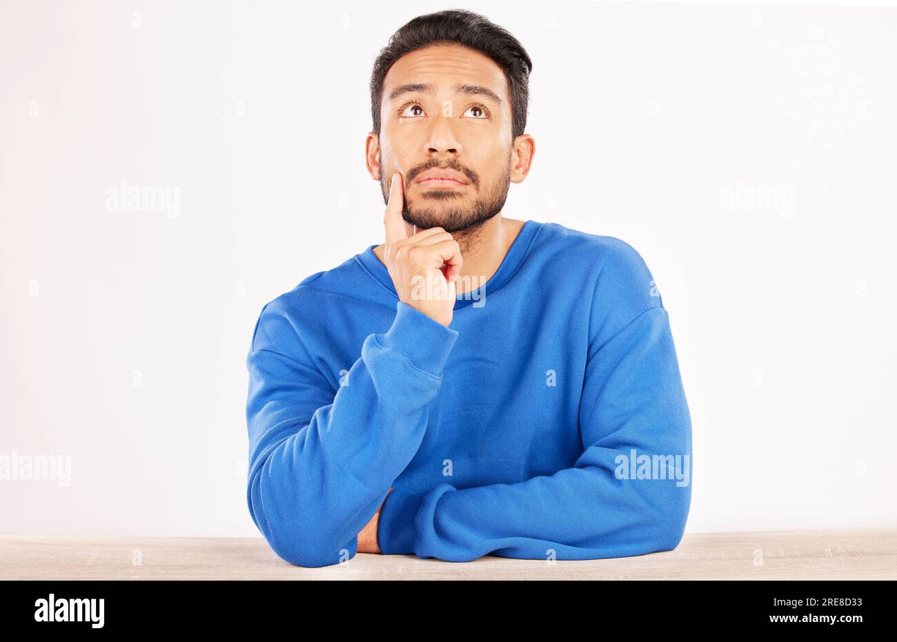 Choice, thinking and space with man and idea in studio for confused ...