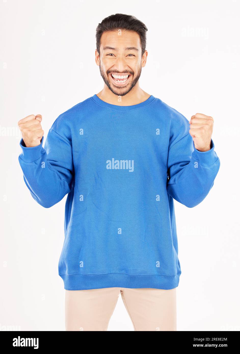 Winner, portrait and man with yes and excited gesture in a studio with ...