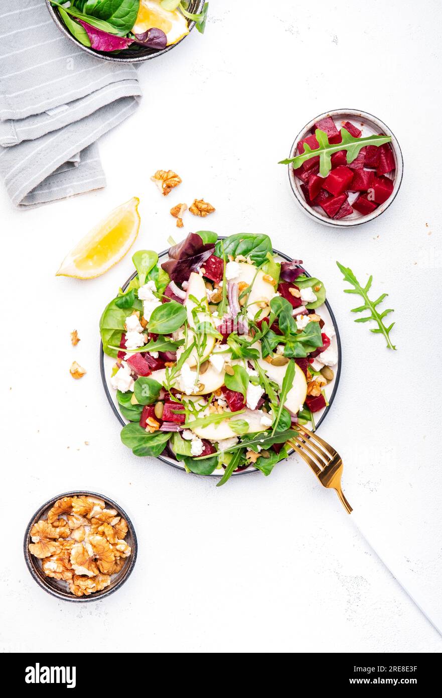 Beetroot, feta cheese and pear salad with arugula, lettuce, red onion ...