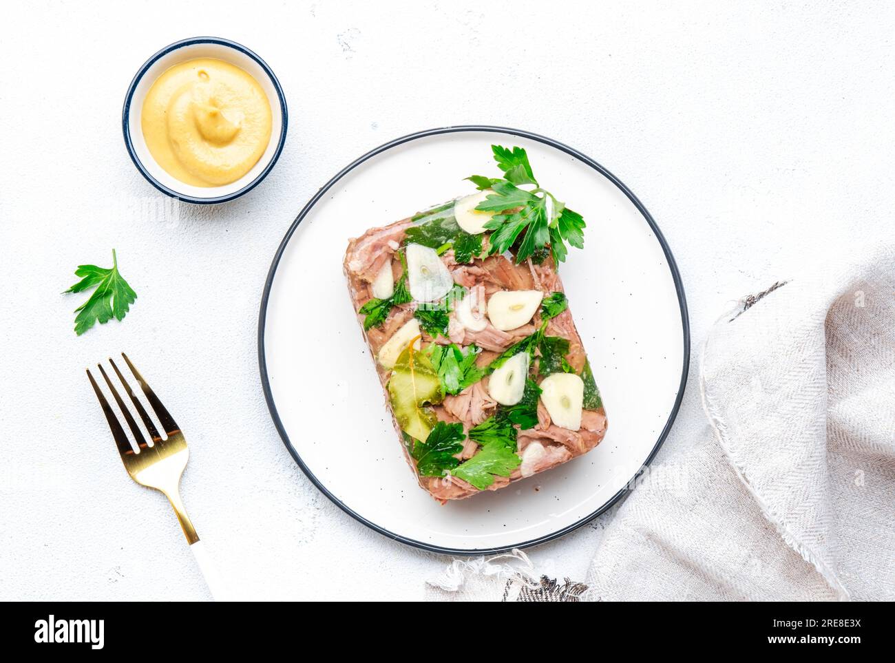 Winter Aspic meat, cold boiled beef in spiced jelly broth on plate with ...