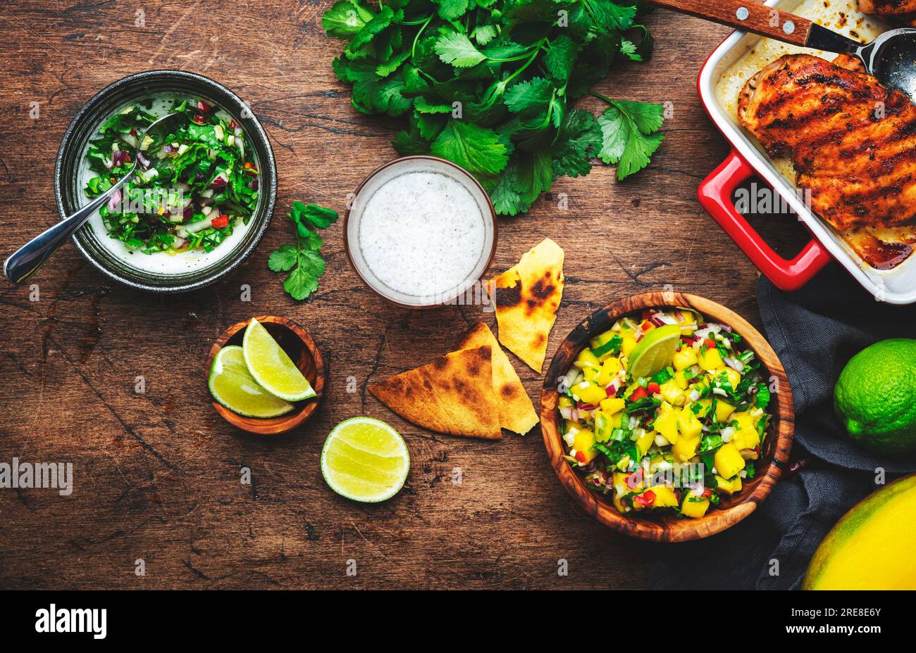 Mango salsa sauce with chili peppers, red onion, garlic, lime and ...