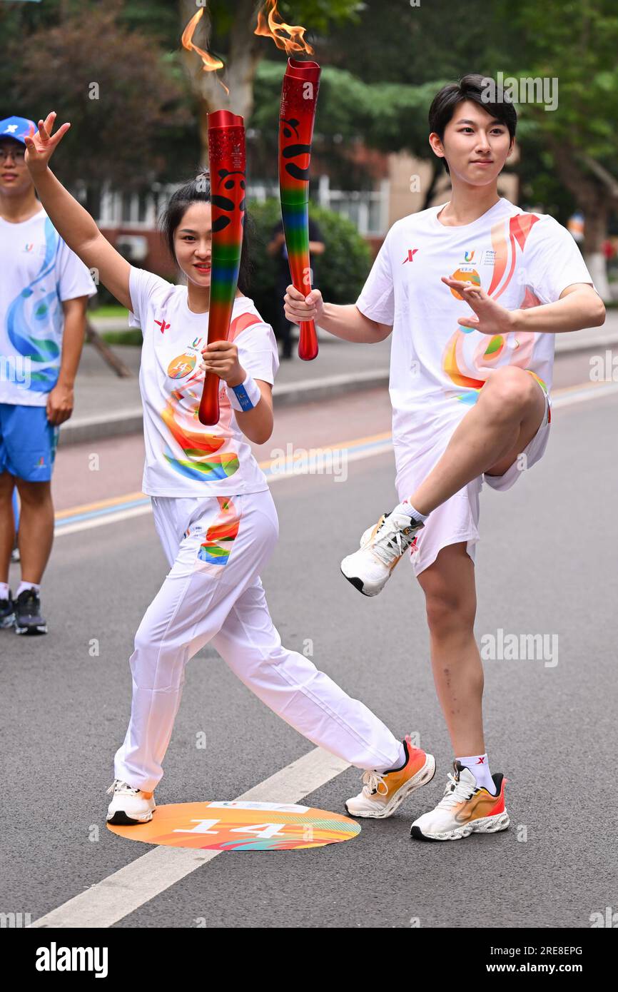 Chengdu, China's Sichuan Province. 26th July, 2023. Torch bearers Cheng ...