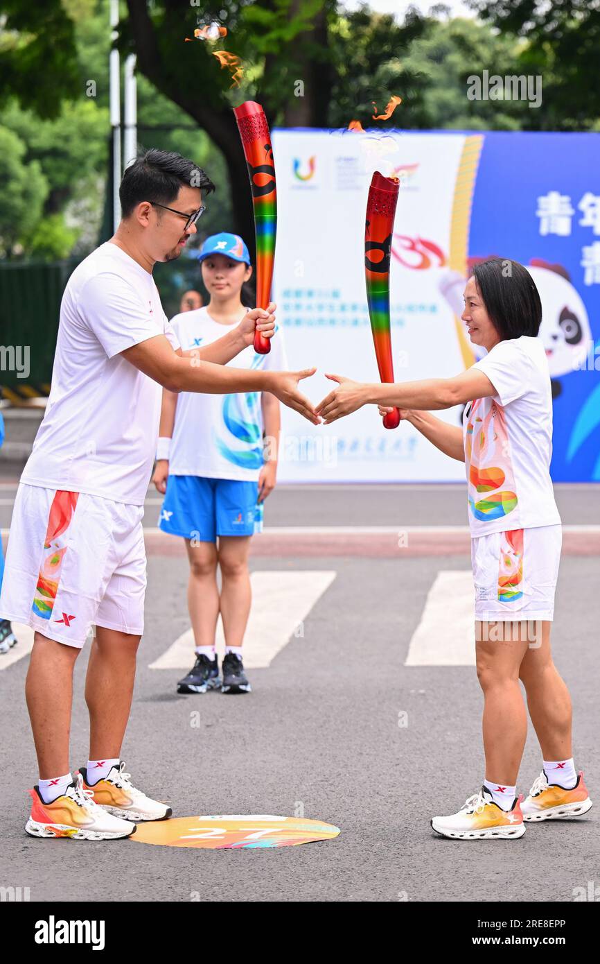 Chengdu, China's Sichuan Province. 26th July, 2023. Torch bearers Zeng ...