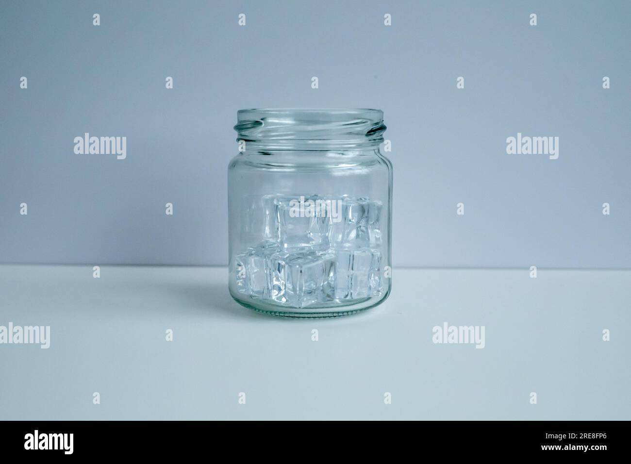 Several ice cubes in a glass jar with a white background Stock Photo ...