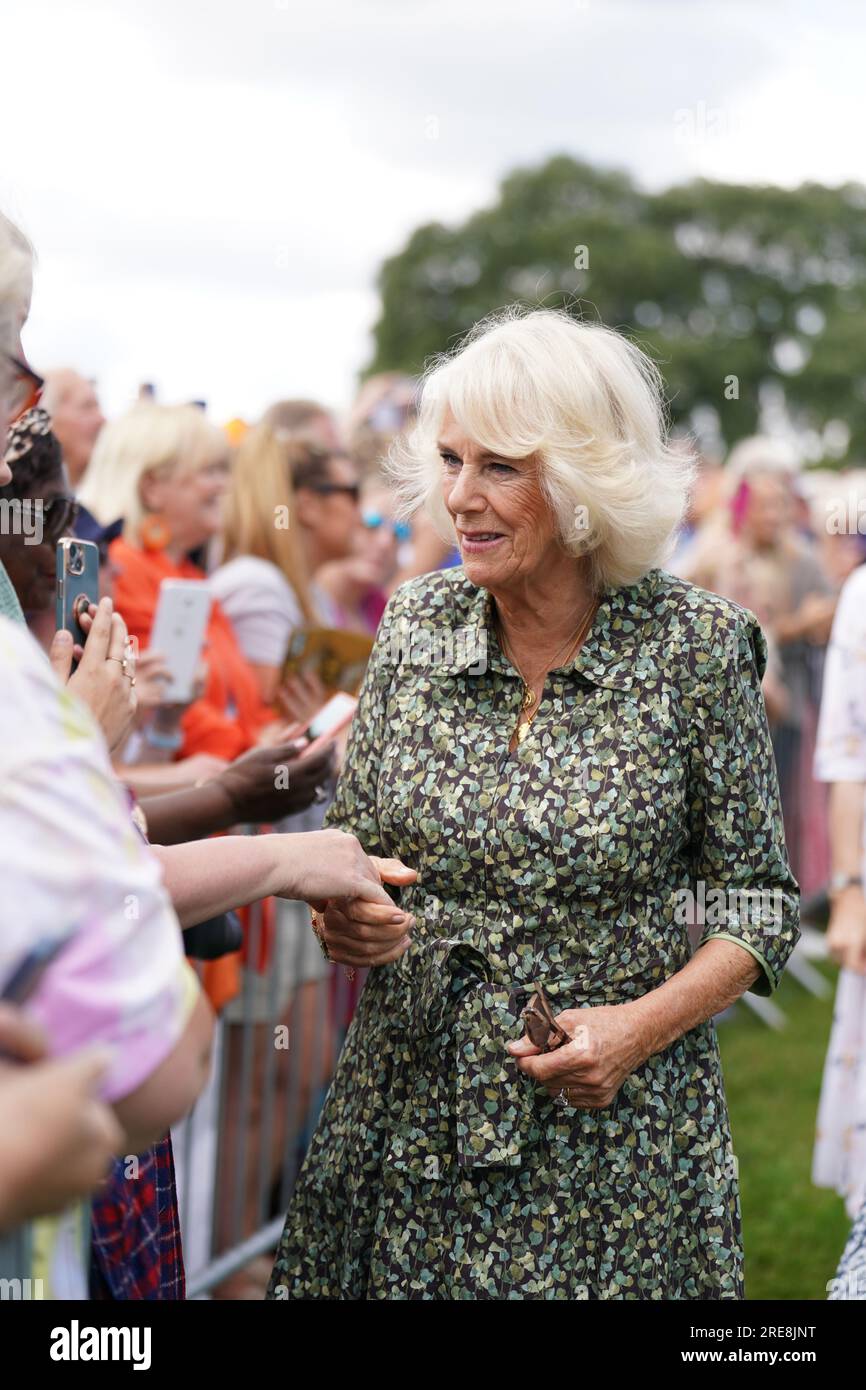 Queen Camilla greets members of the public during a visit to the ...