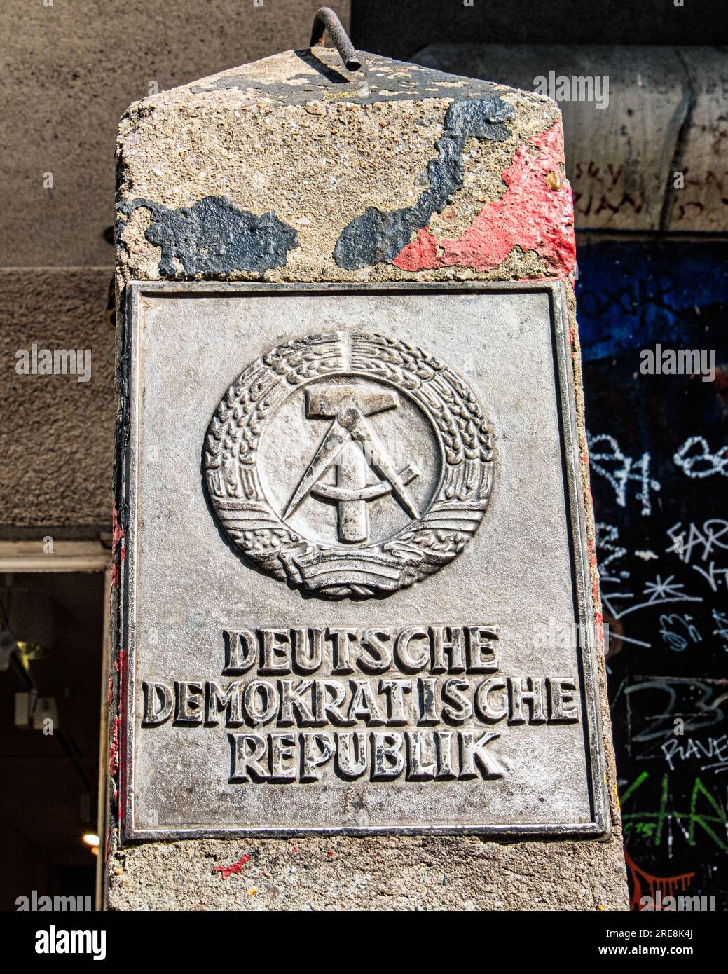 GDR National Emblem on post outside Checkpoint Charlie Museum in Mitte ...