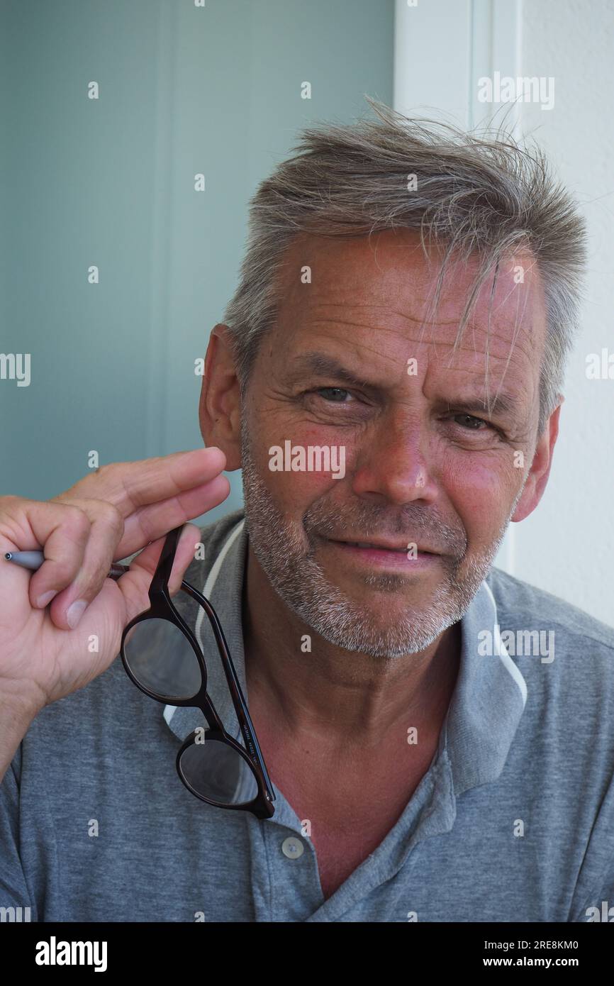 Older Man Tanned With Glasses Stock Photo - Alamy