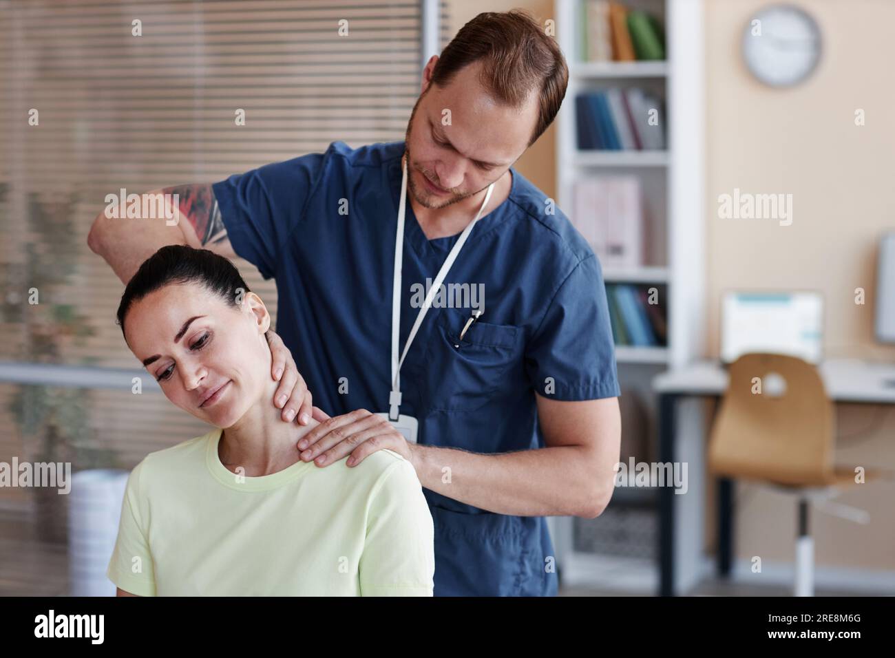 Massage therapist doing massage to patient during her visit to hospital ...