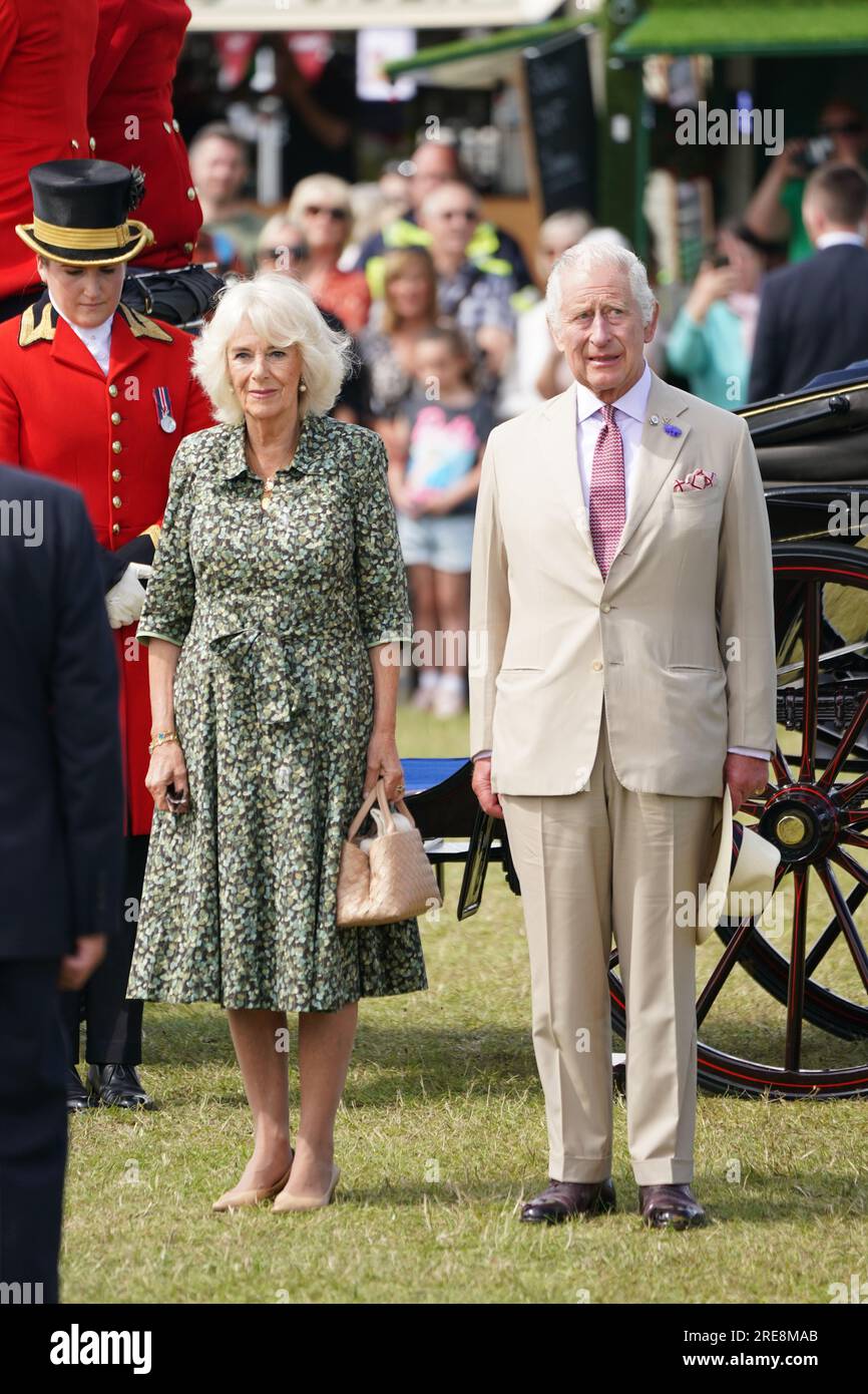 King Charles III and Queen Camilla stand for the national anthem during ...