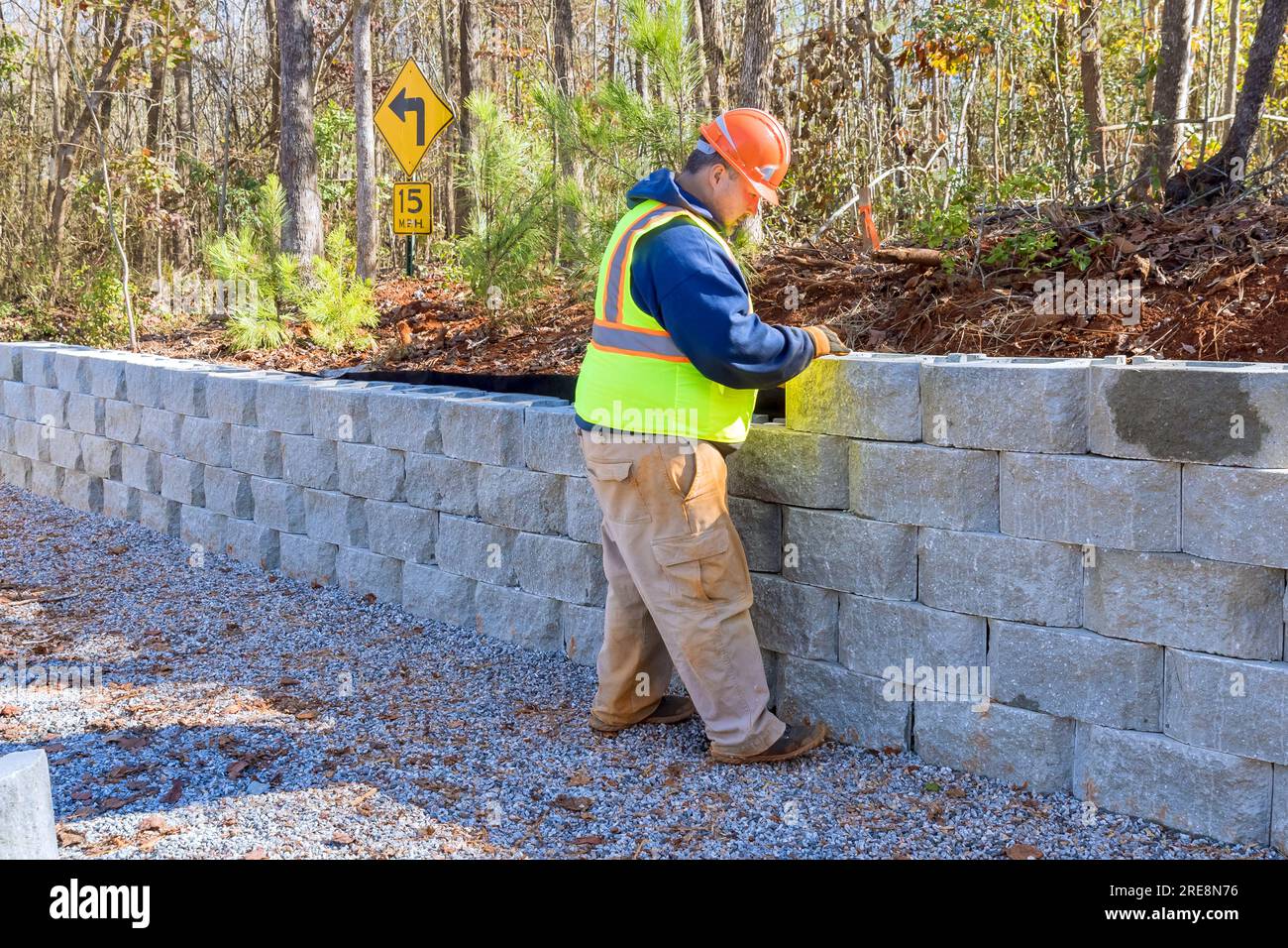 During development of new property, construction worker is using cement ...