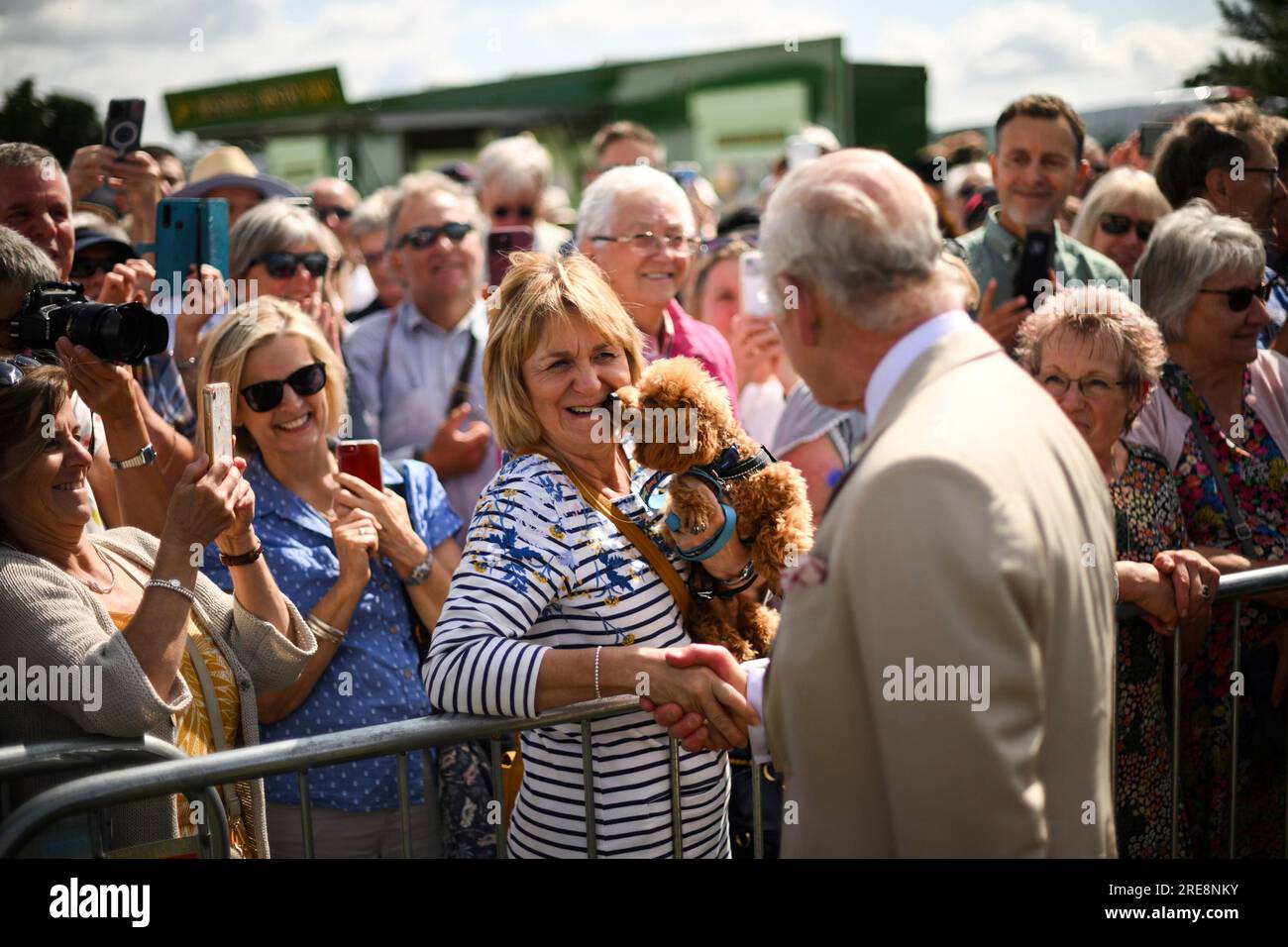 King Charles III greets members of the public as he arrives to visit to ...