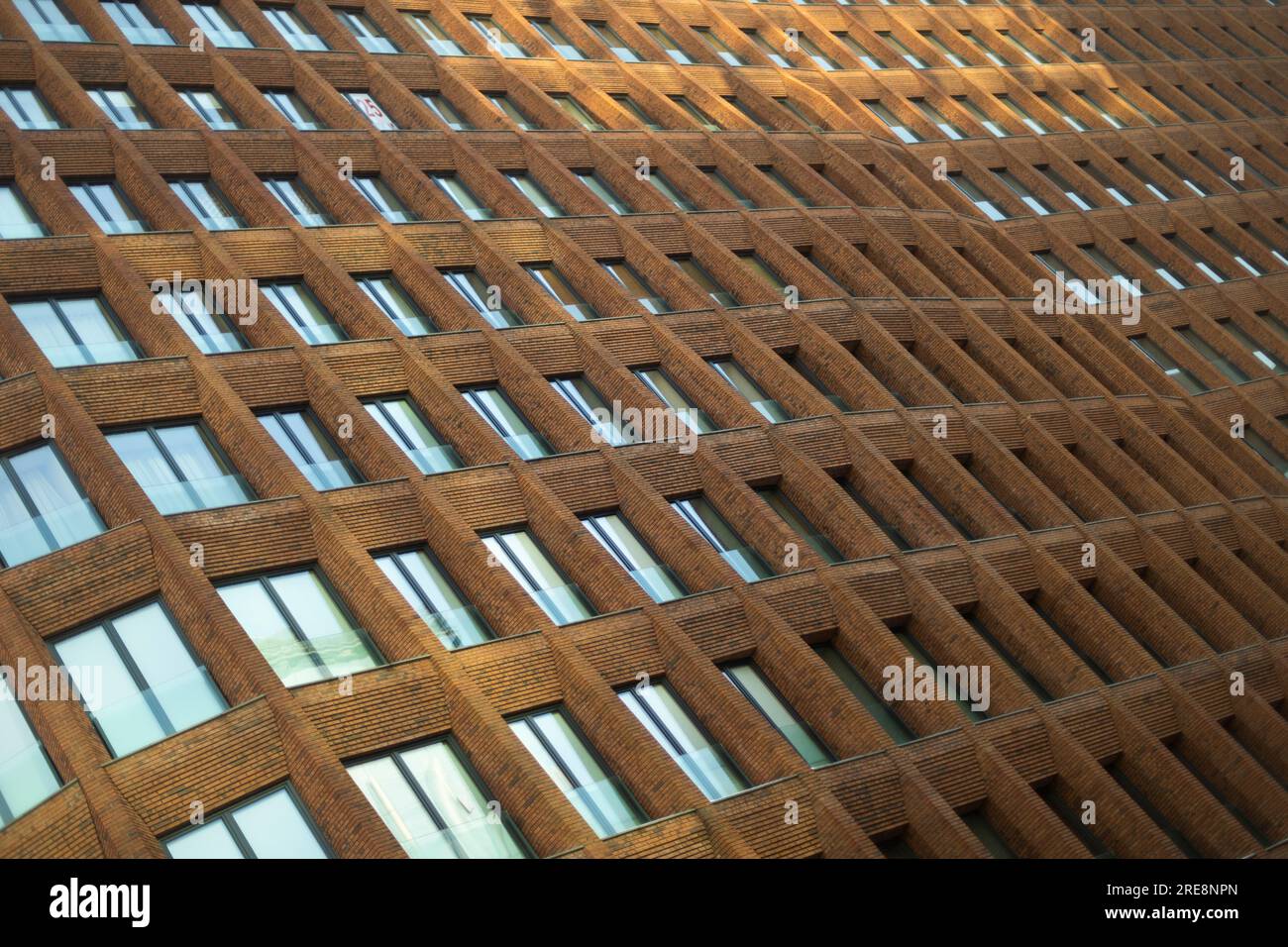 Windows in building. Brick house. Modern architecture. Lots of windows ...