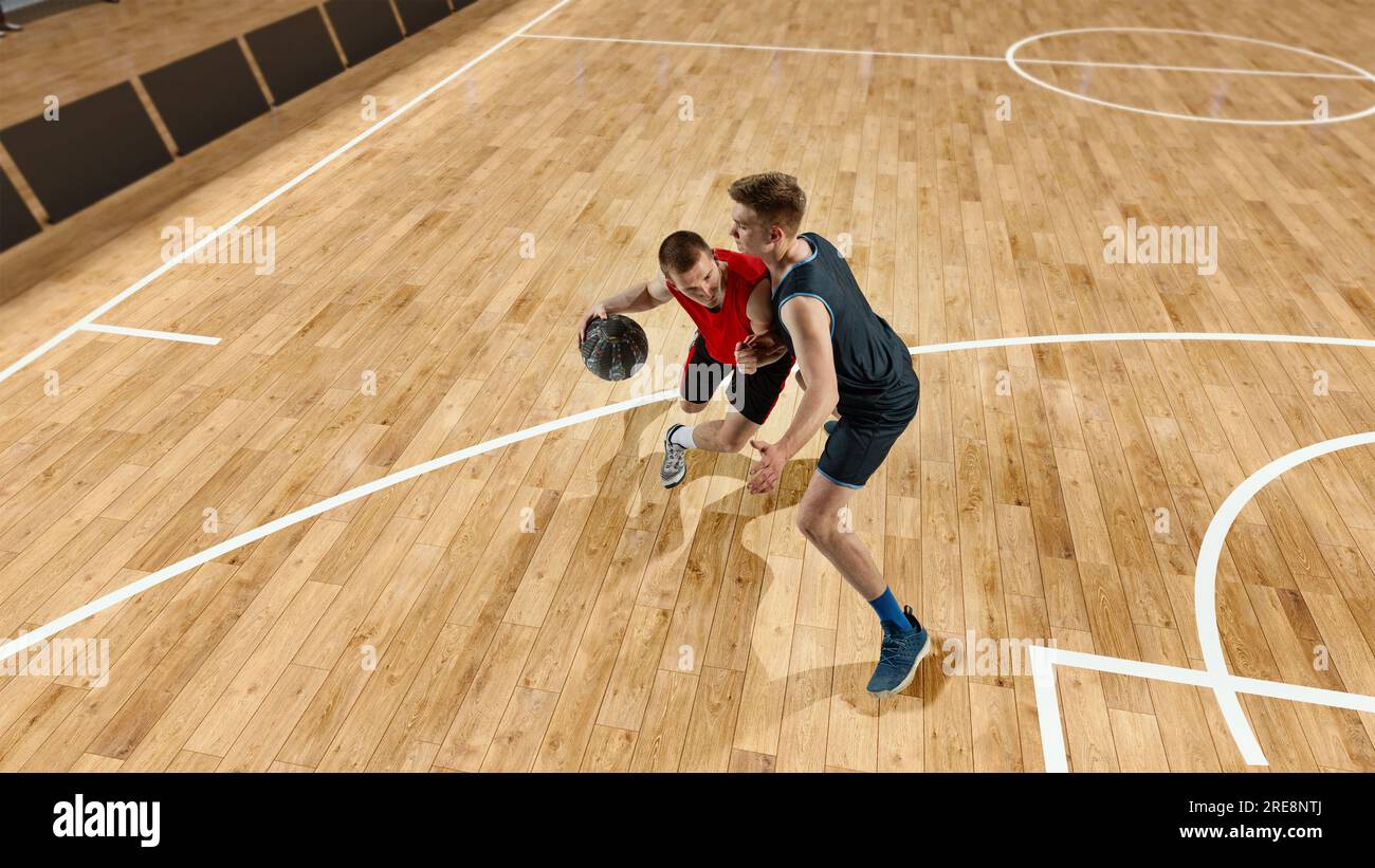 Top view image of two, basketball player in motion during match with ...