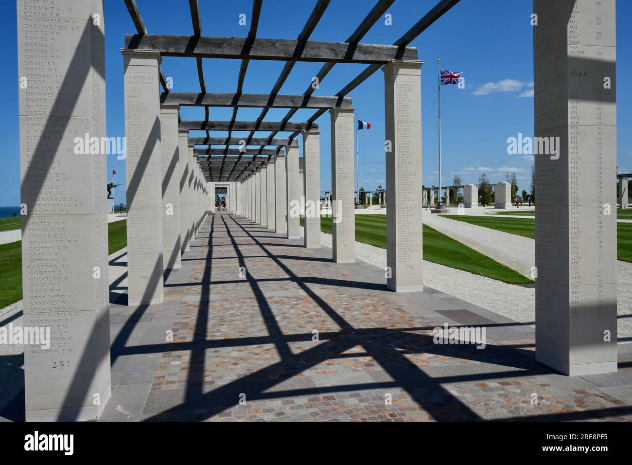 Stone Walkways at The British Normandy Memorial, with blue skies above ...