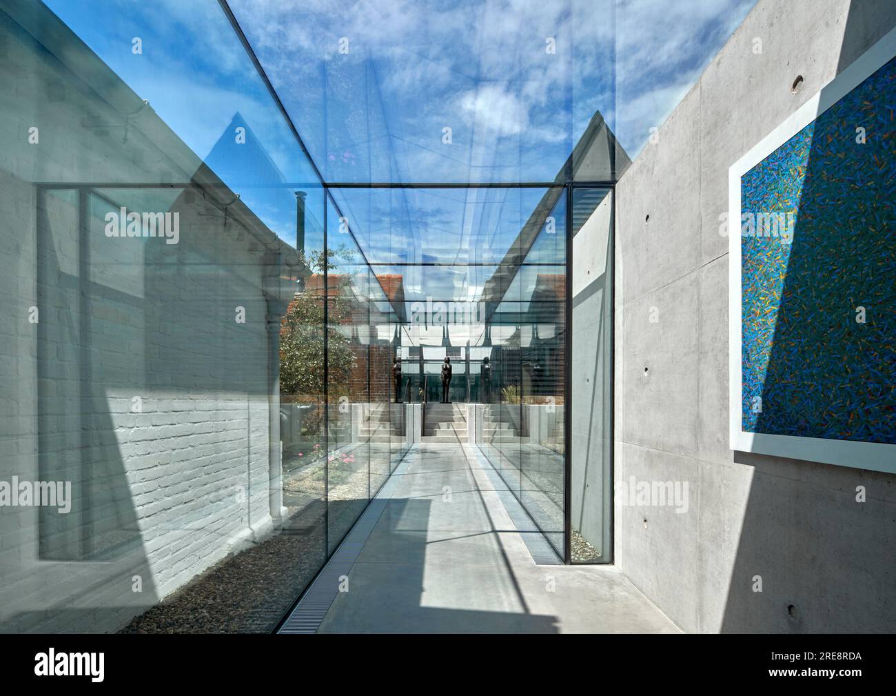 Interior view down glass corridor. Listed Farmstead, Suffolk, United ...