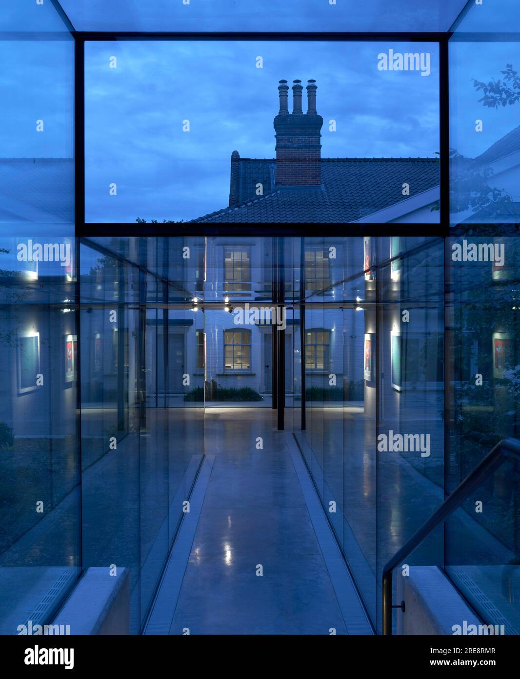 Interior view showing glass link corridor at dusk. Listed Farmstead ...