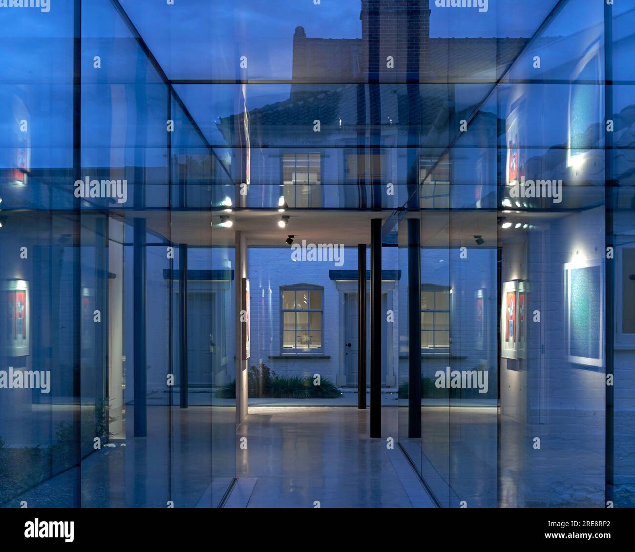 Interior view showing glass link corridor at dusk. Listed Farmstead ...