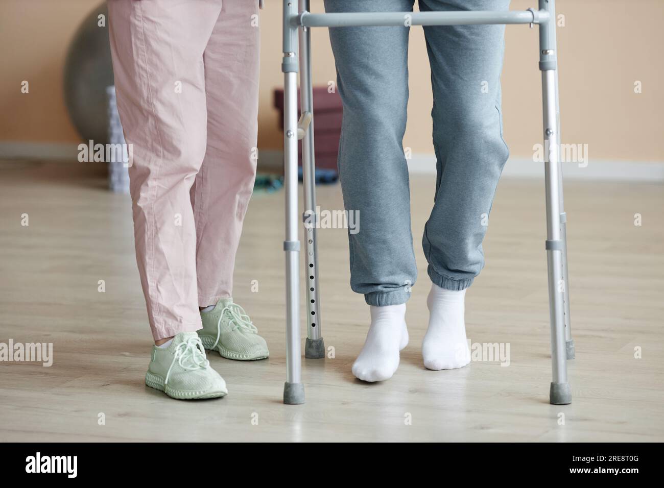 Physiotherapist helping patient walk hi-res stock photography and ...