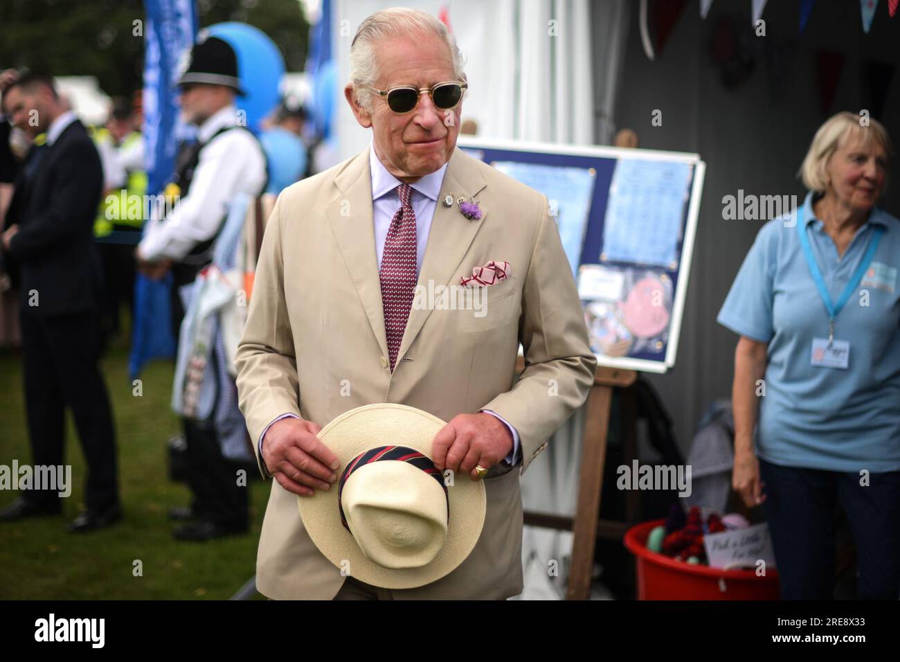 King Charles III reacts to members of the public during a visit to the ...