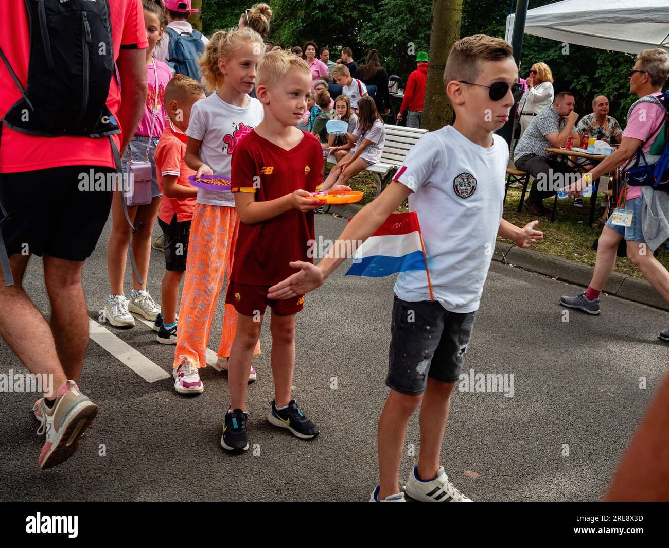 July 19, 2023, Wijchen, Netherlands: Little children are seen asking ...