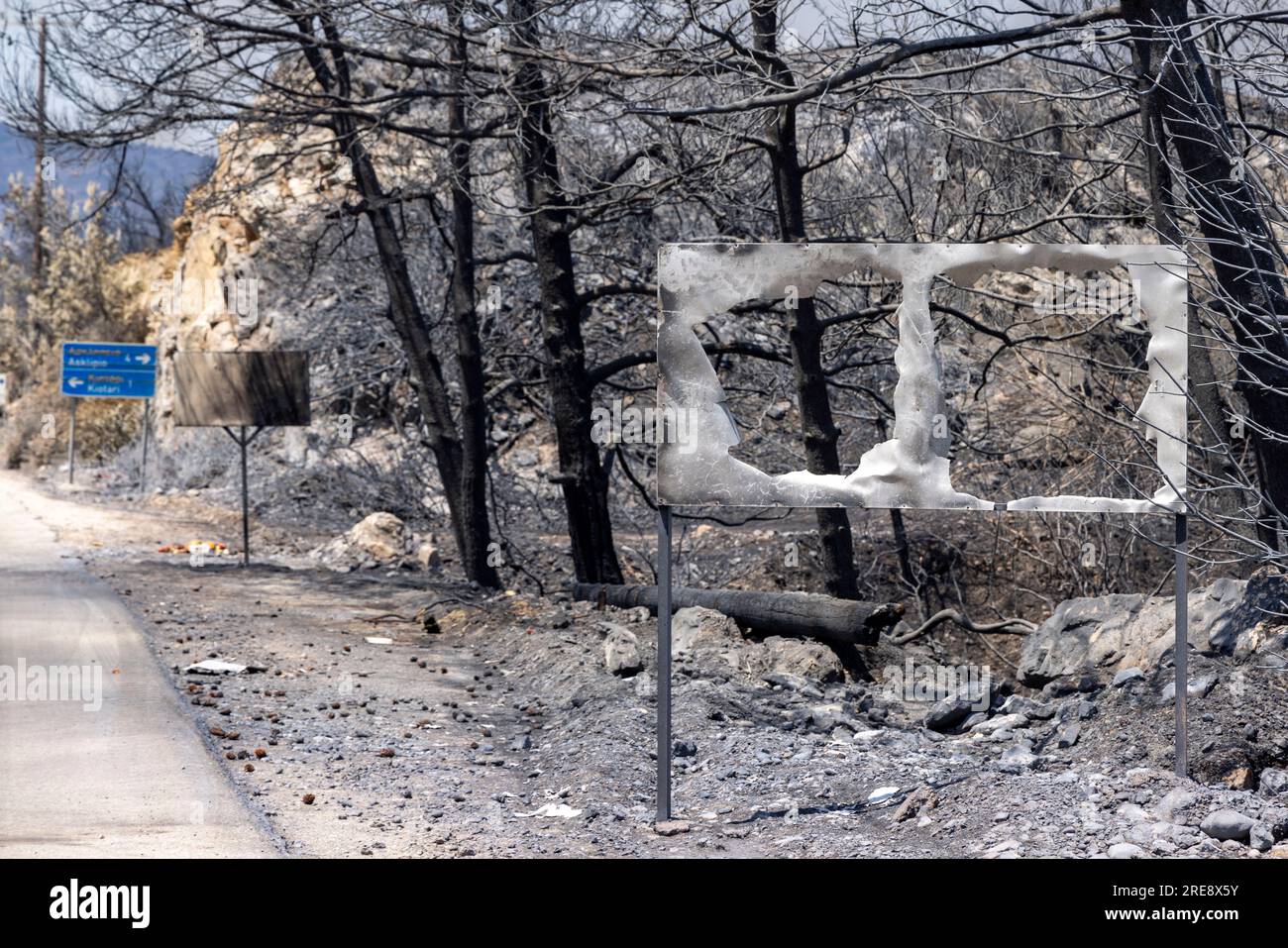 Greece. 26th July, 2023. A burnt road sign stands on the side of the ...