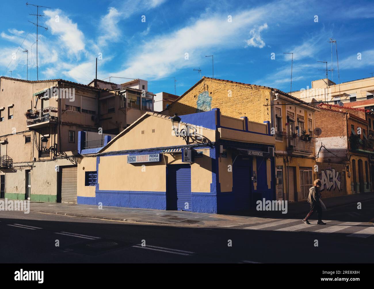 Sight of the bohemien Cabanyal in Valencia with man walking and long ...