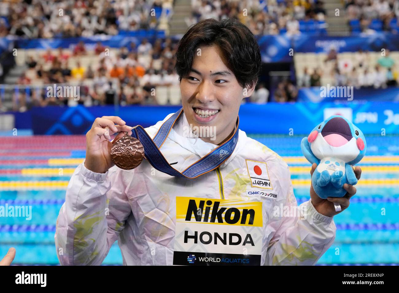 Bronze medalist Tomoru Honda of Japan, celebrates after the medal ...