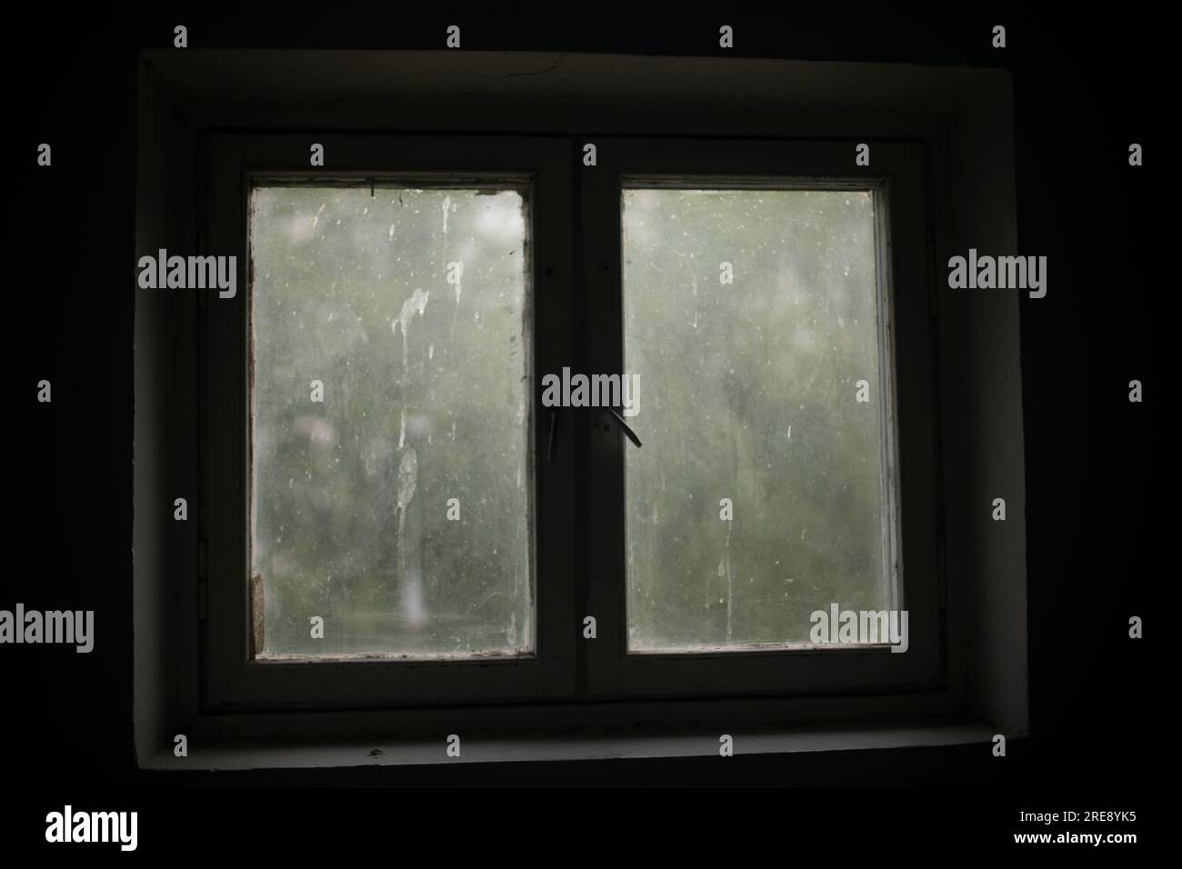 Window in building. Interior details. Window in dark room. Cloudy glass ...