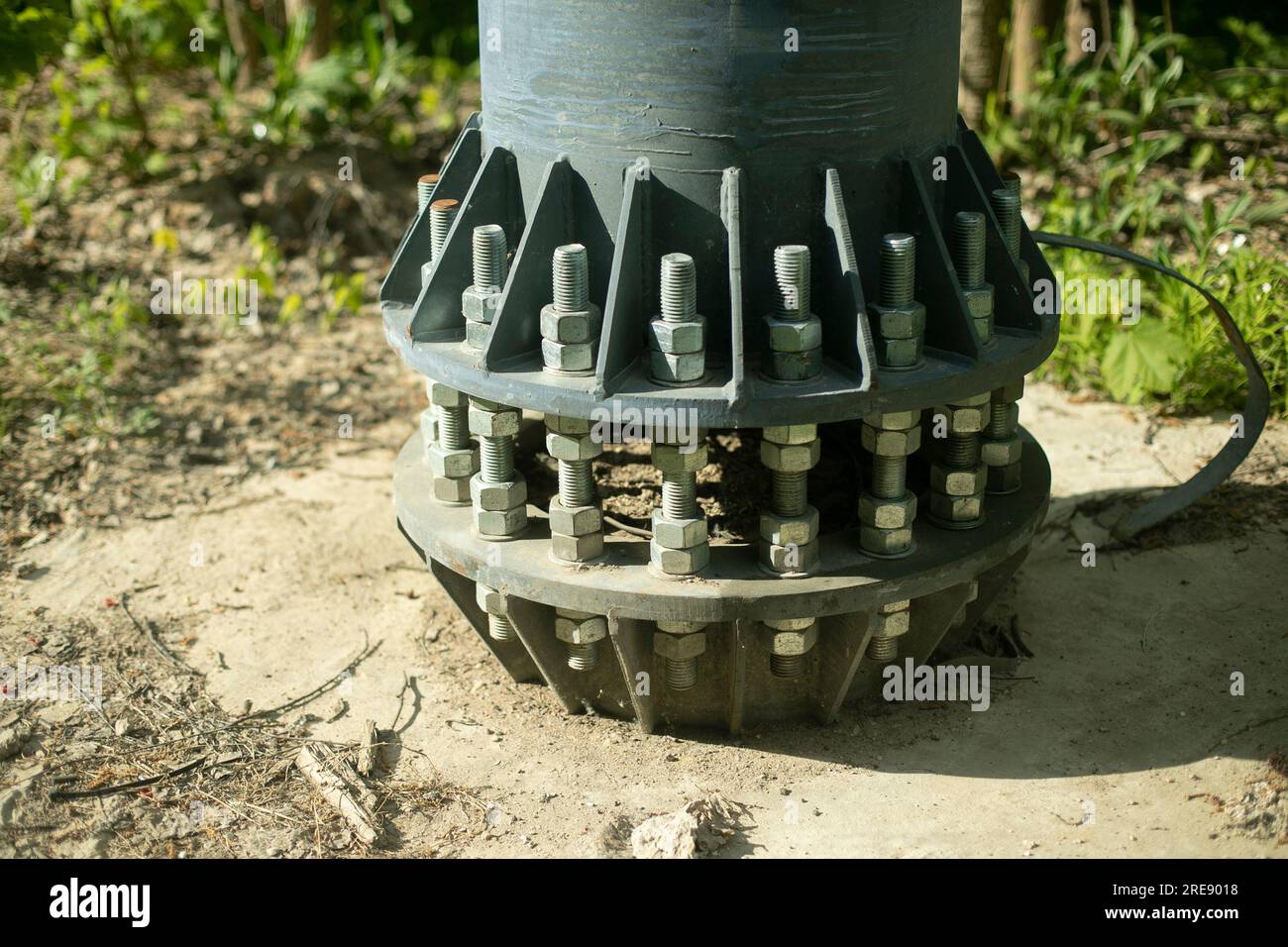 Base of pillar. Pillar Foundation. Large nuts on structure. Steel ...