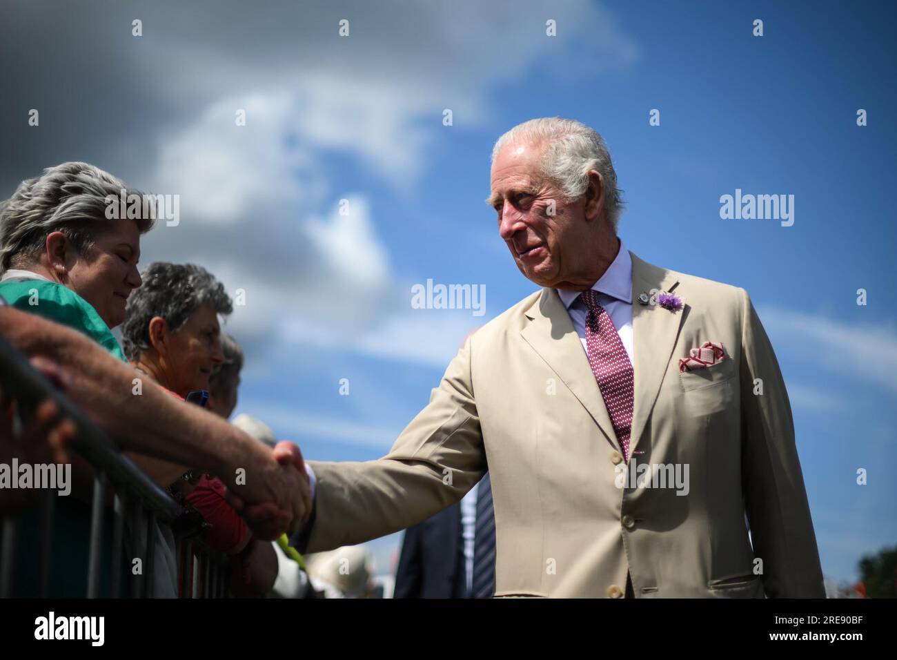 King Charles III reacts as he meets members of the public during a ...