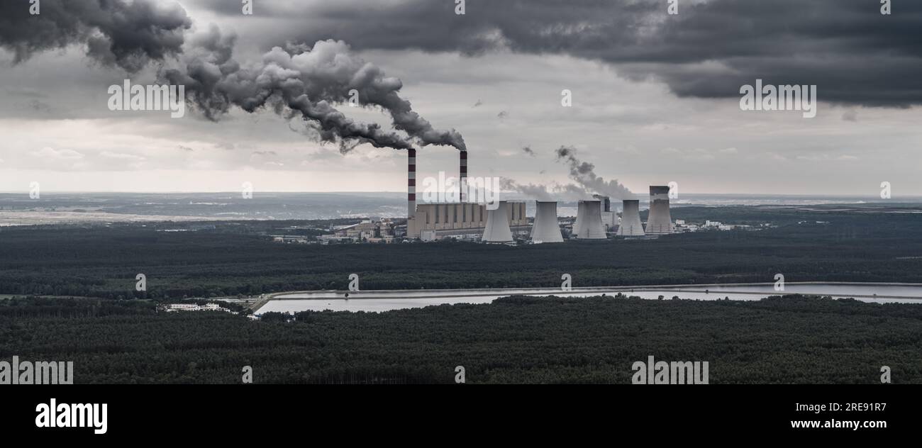 Aerial view of power plant, smoke from chimneys and open-cast coal mine ...