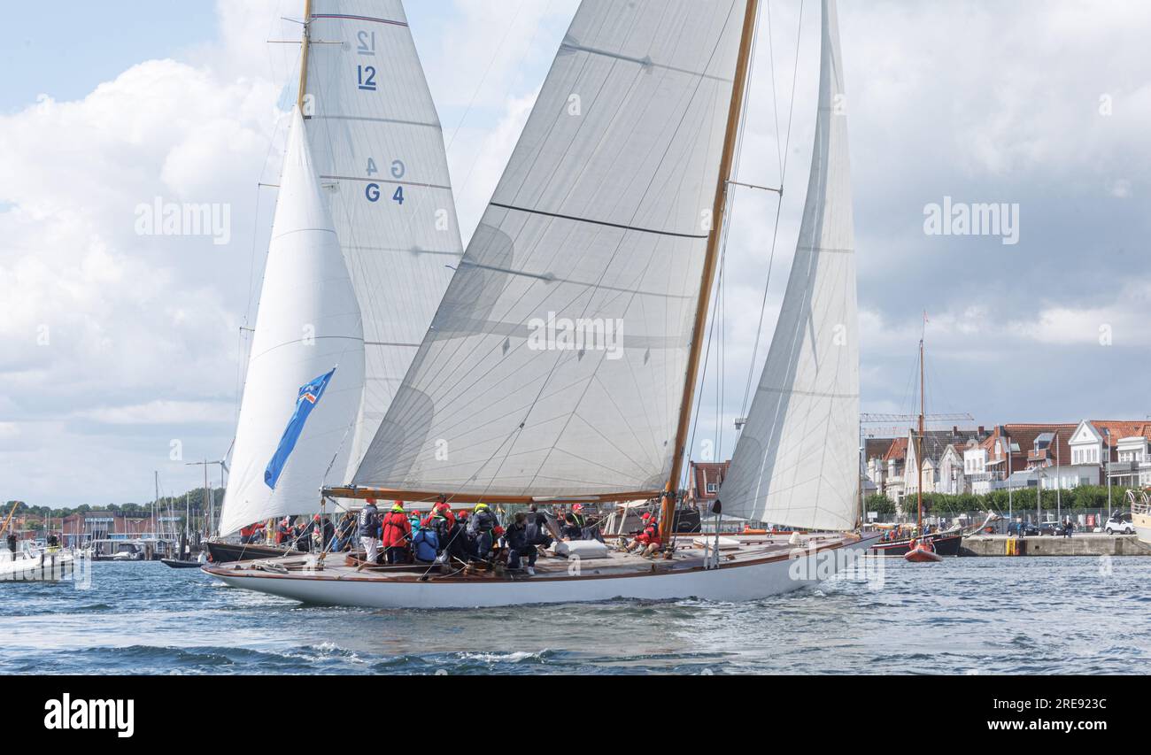 26 July 2023, Schleswig-Holstein, Lübeck-Travemünde: Two sailing yachts ...