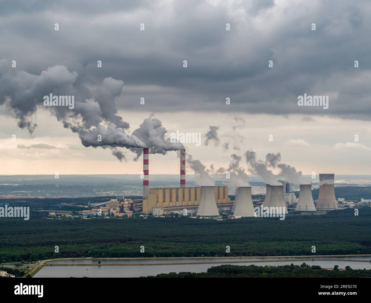 Aerial view of power plant, smoke from chimneys and open-cast coal mine ...
