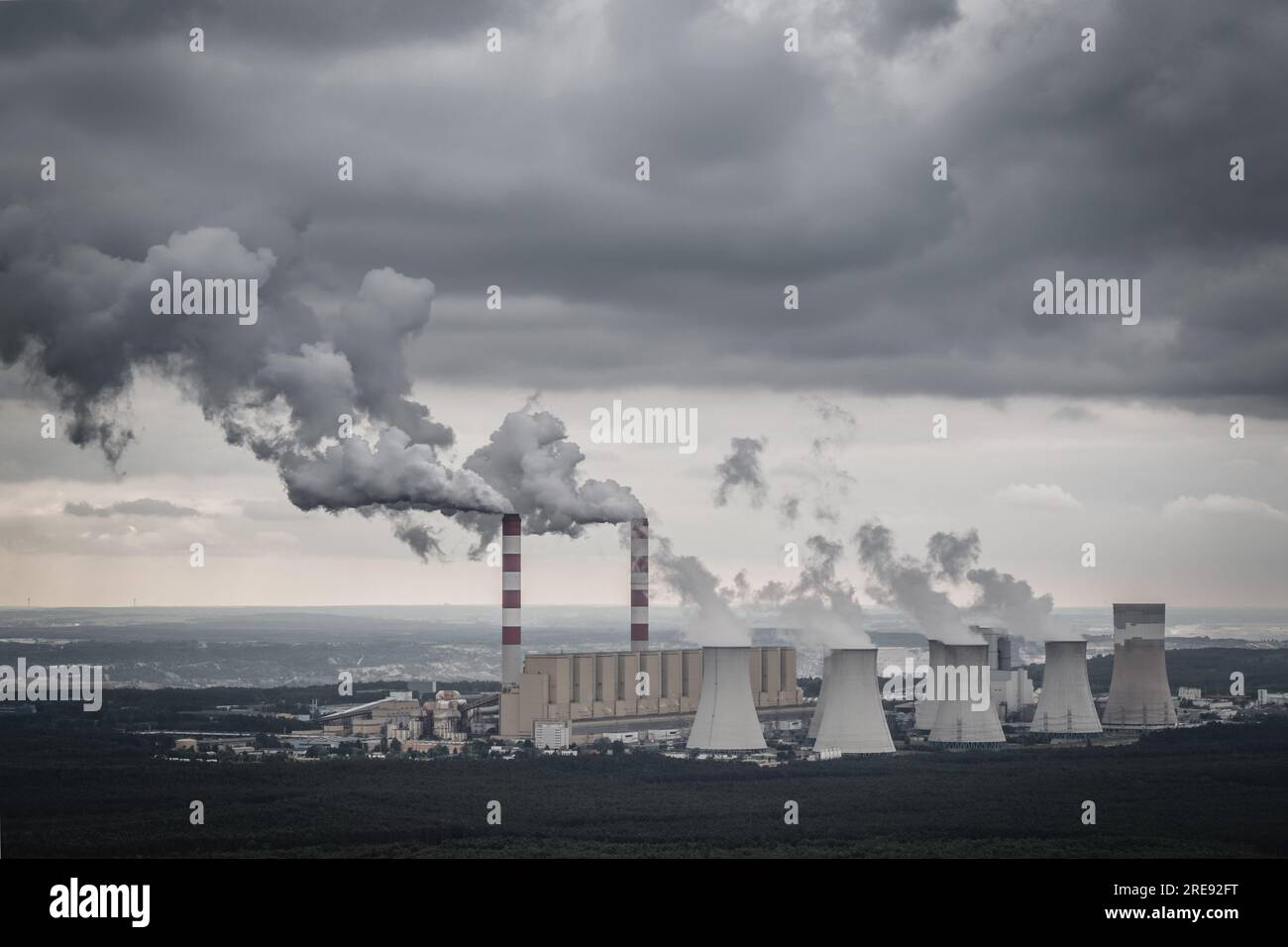Aerial view of power plant, smoke from chimneys and open-cast coal mine ...