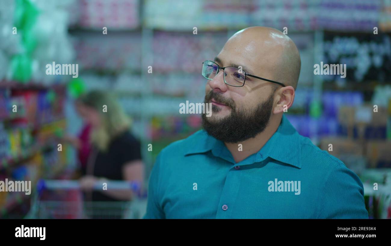 Customer looking at products in supermarket aisle. Person shopping ...