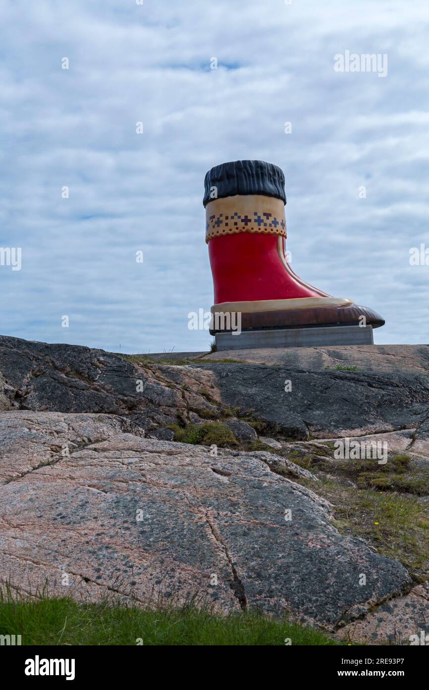 Large red Inuit boot on top of rocky outcrop at Qaqortoq, Greenland in ...