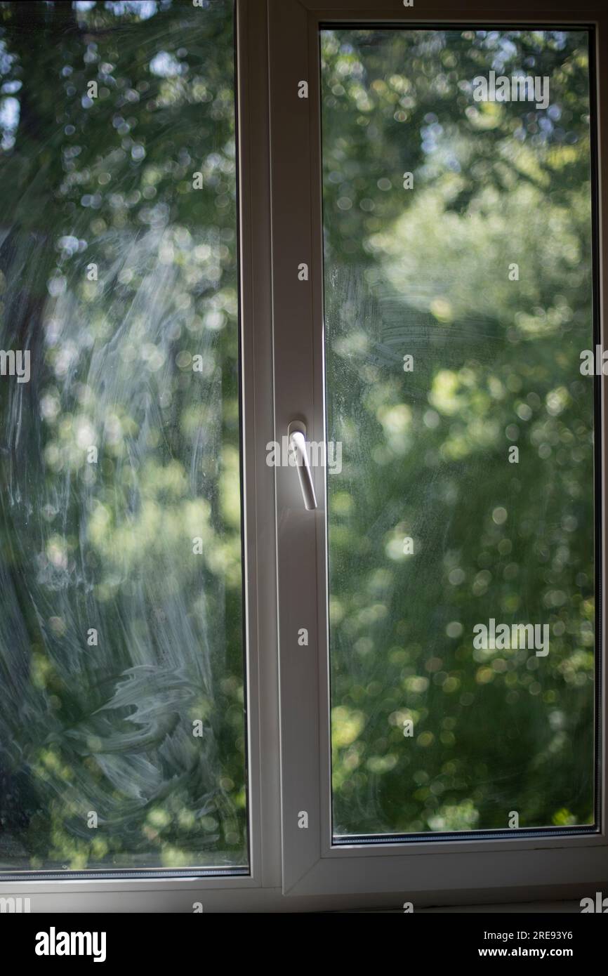 Window in room. Light on glass. White window of house. Morning light in ...